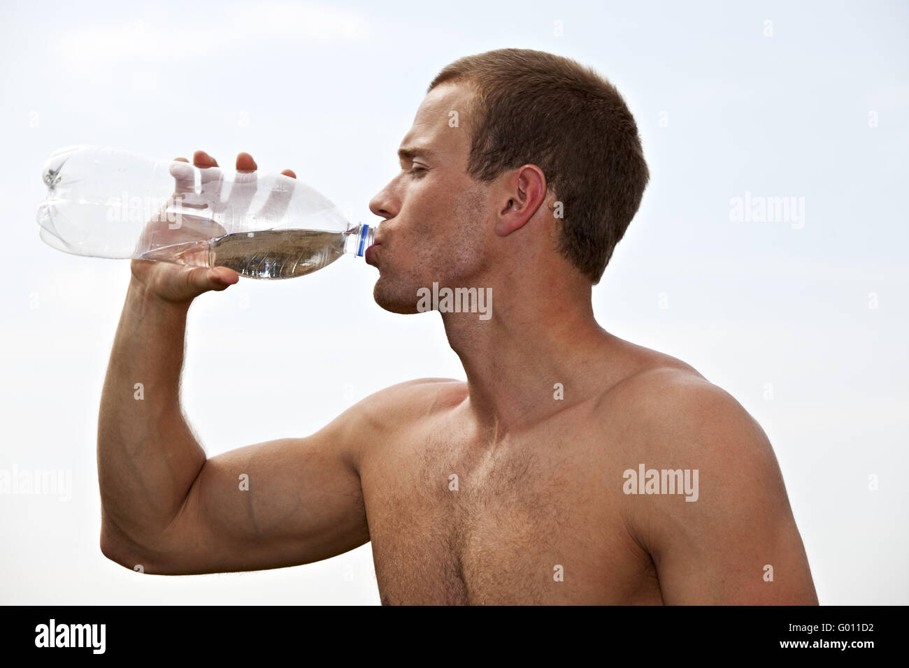 young man drinking water Stock Photo - Alamy