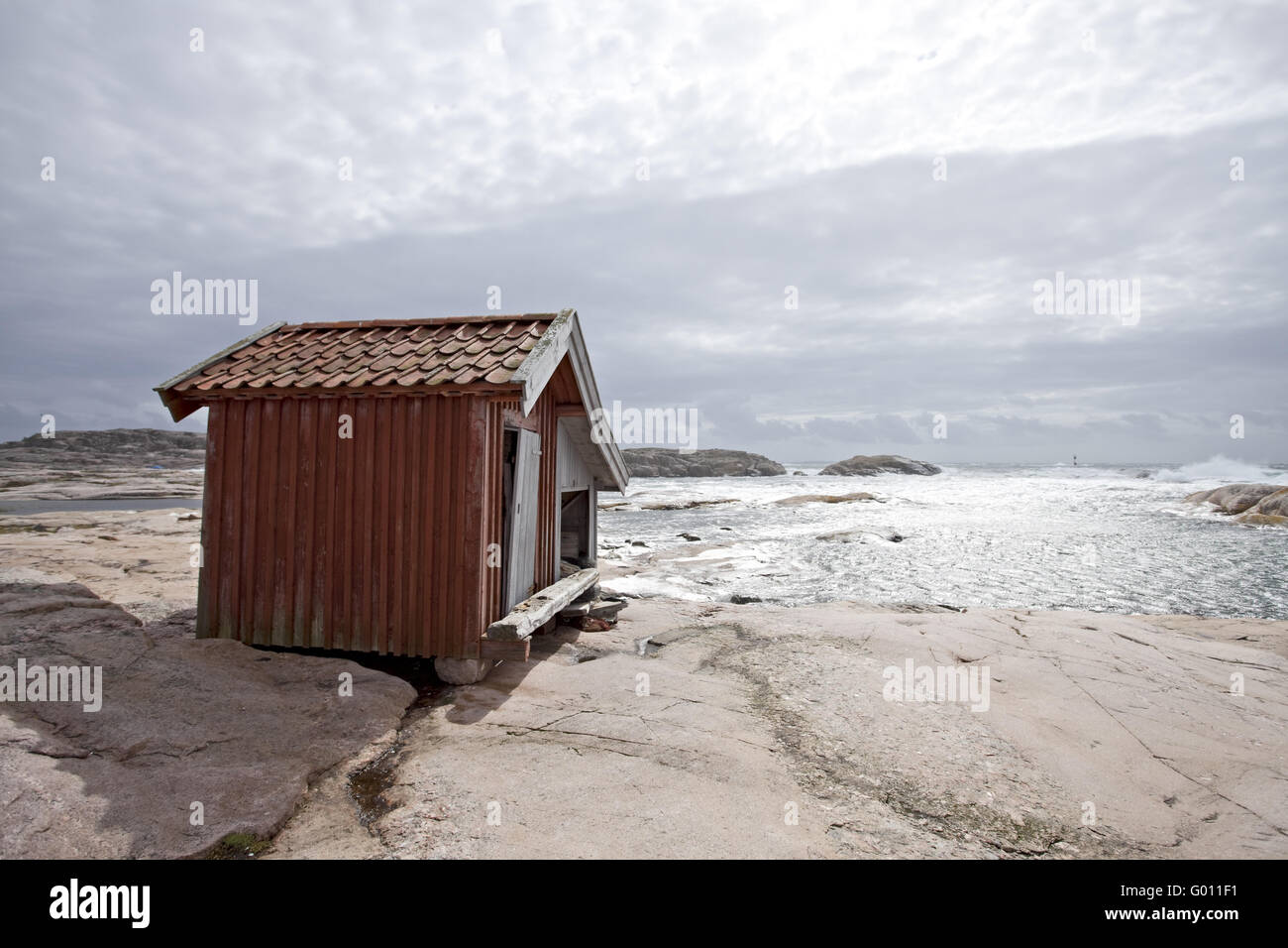 hut on a beach on a windy day Stock Photo - Alamy