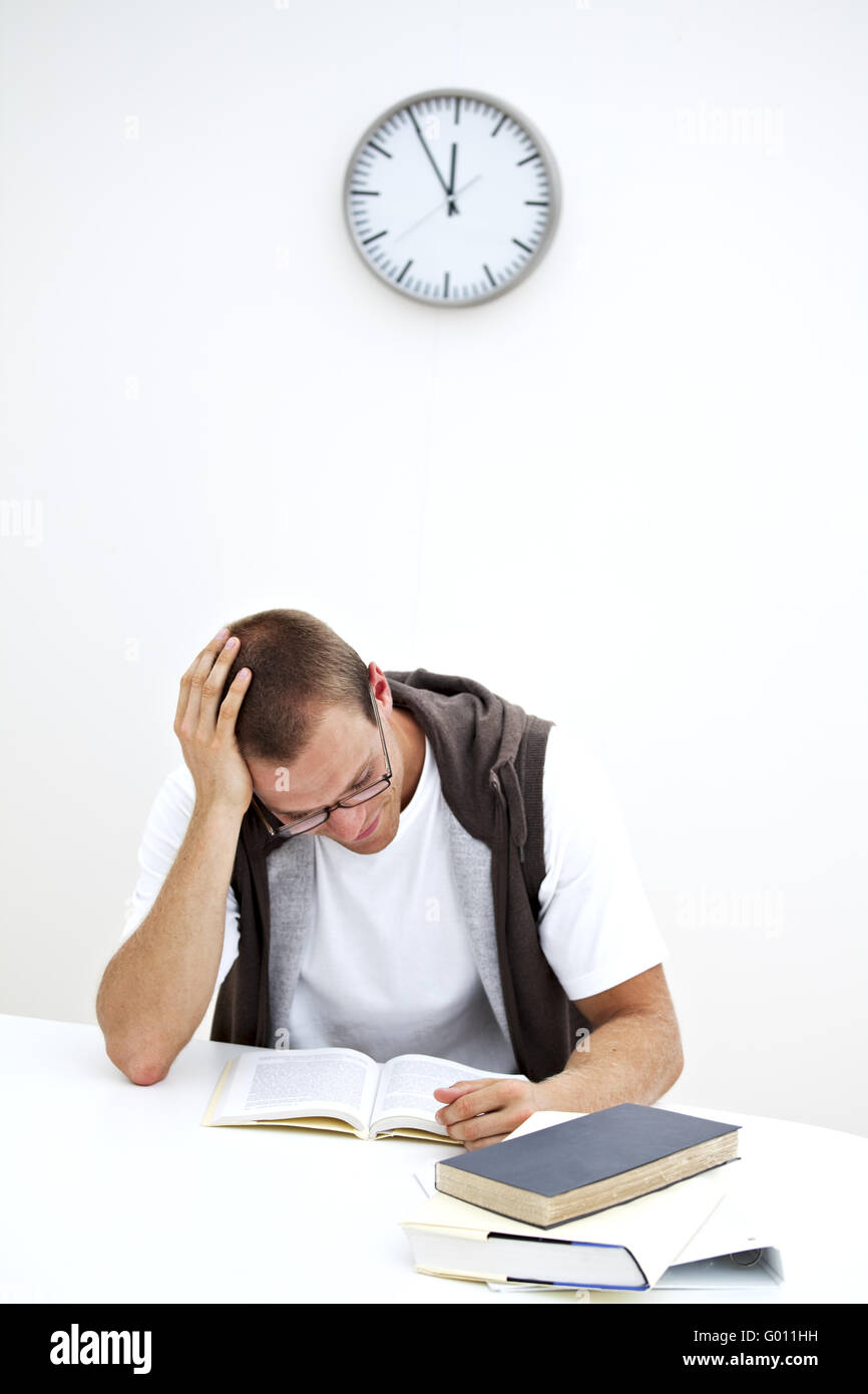 student reading under a clock Stock Photo - Alamy