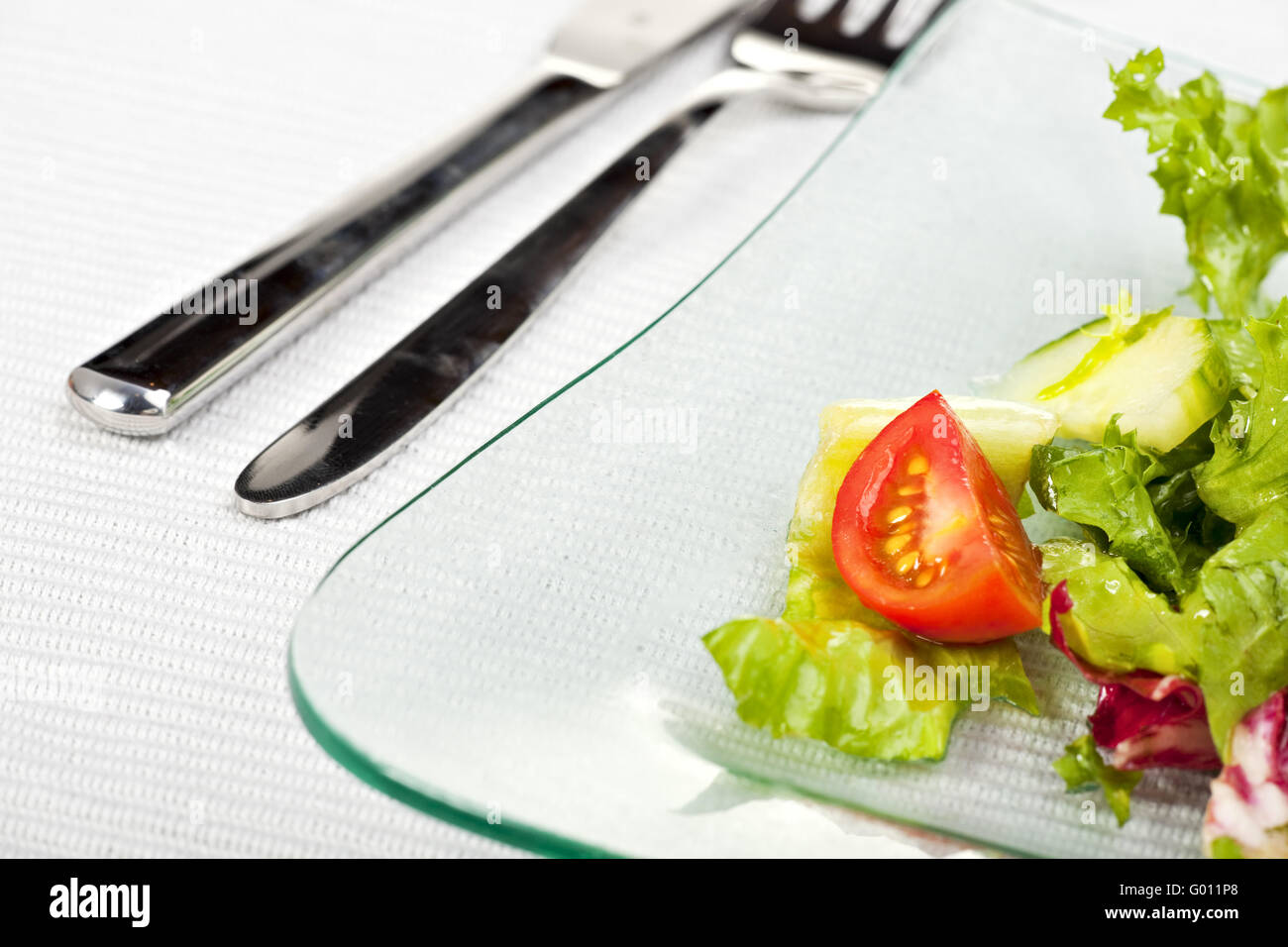 mixed salad on a glass plate Stock Photo - Alamy