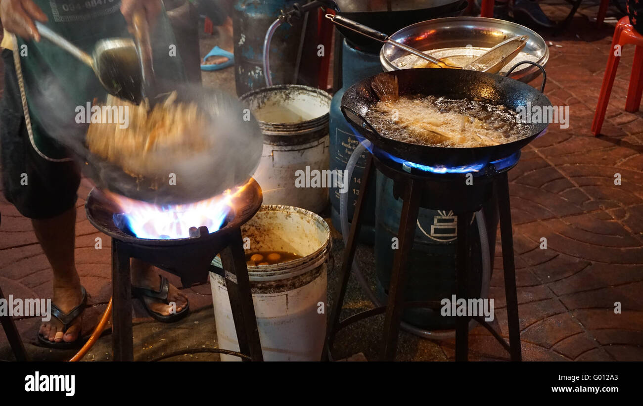 traditional asian street food cooked in a wok Stock Photo - Alamy
