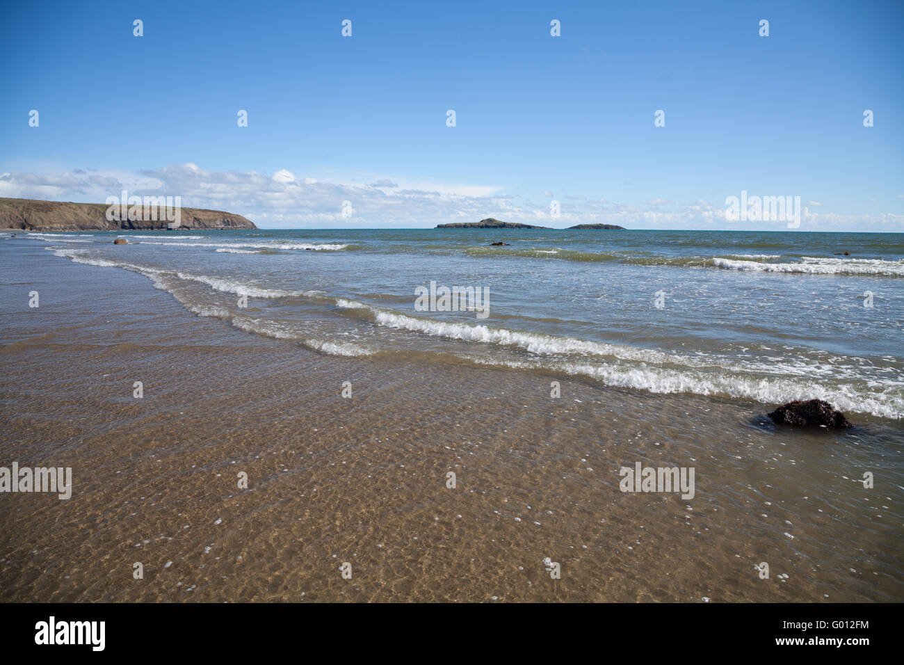 View across the beach towards the islands Gwylan Fawr and Gwylan Fach ...