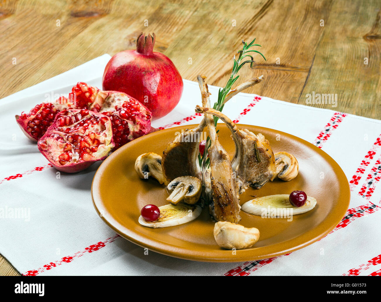 dish of mutton ribs, mushrooms, pomegranate Stock Photo - Alamy