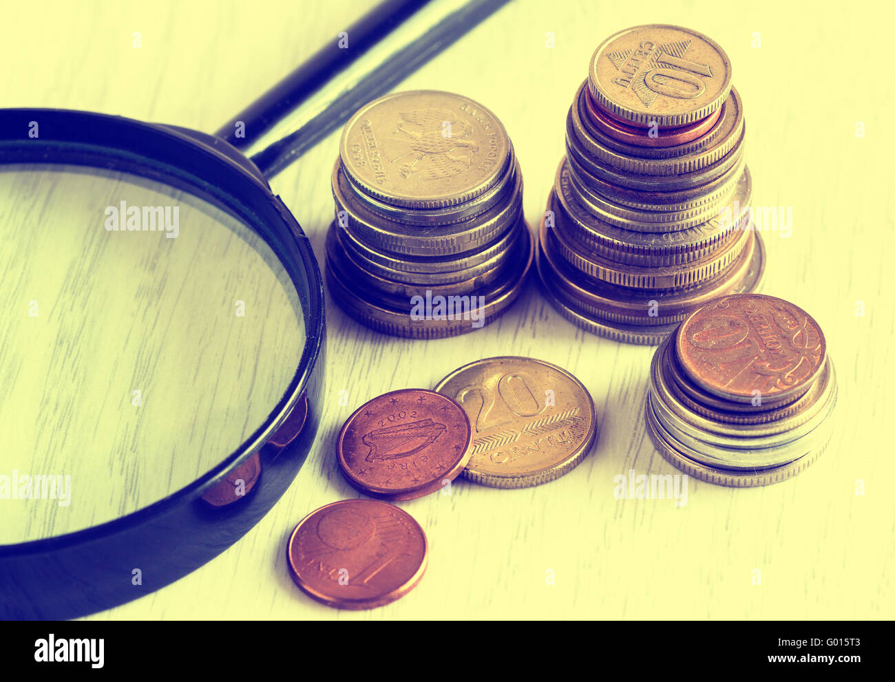 pen, coins and a magnifying glass, retro Stock Photo - Alamy
