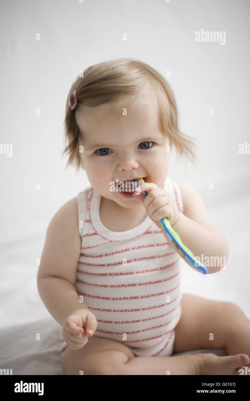 baby, cleaning her teeth Stock Photo - Alamy