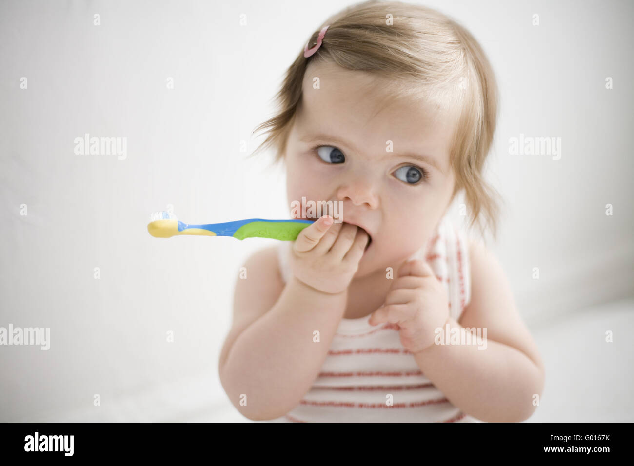 baby, cleaning her teeth Stock Photo - Alamy