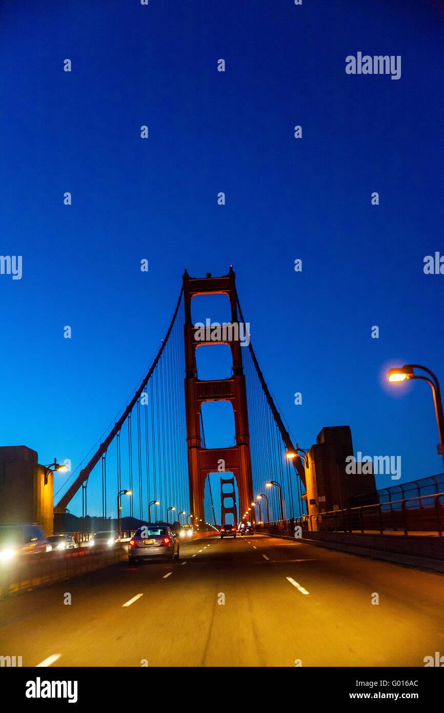 Crossing the Golden Gate Bridge at night just after sunset Stock Photo ...