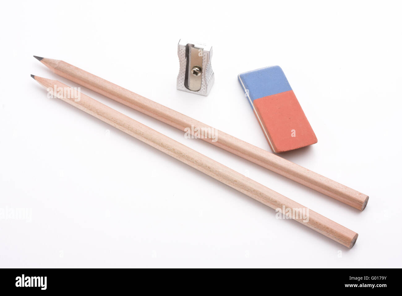 pencils, a sharpener and a eraser on white background Stock Photo - Alamy