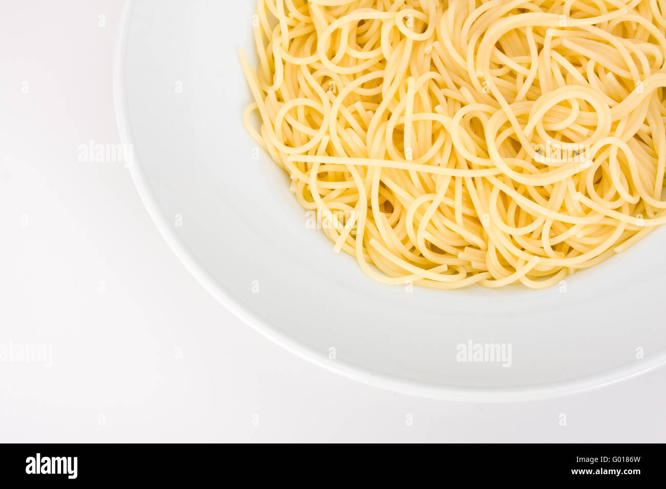spaghetti in a white plate on clear background Stock Photo - Alamy