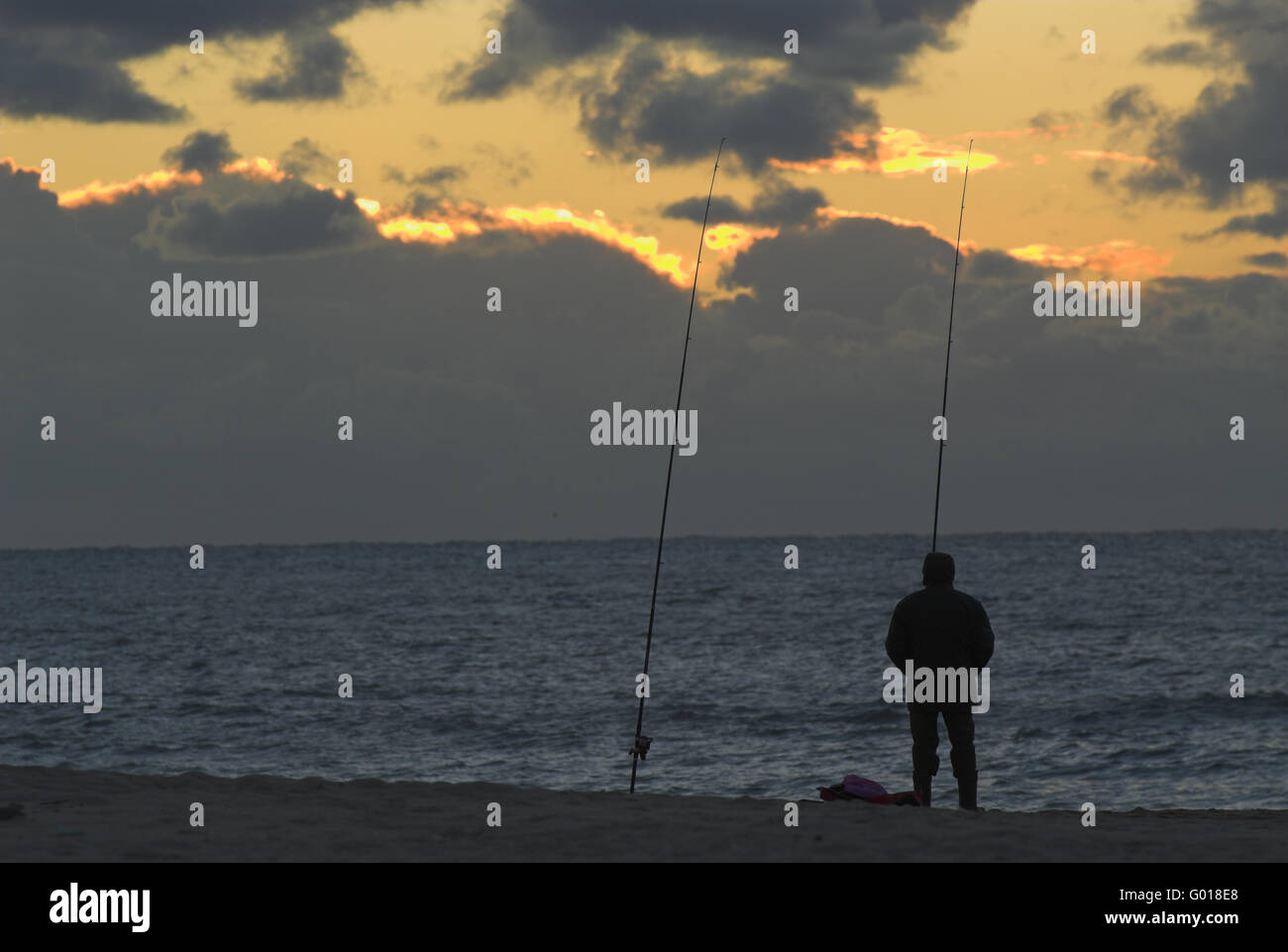 Angler am Strand - fishing man at the beach Stock Photo - Alamy