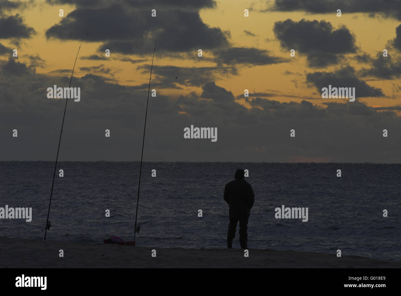Angler am Strand - fishing man at the beach Stock Photo - Alamy