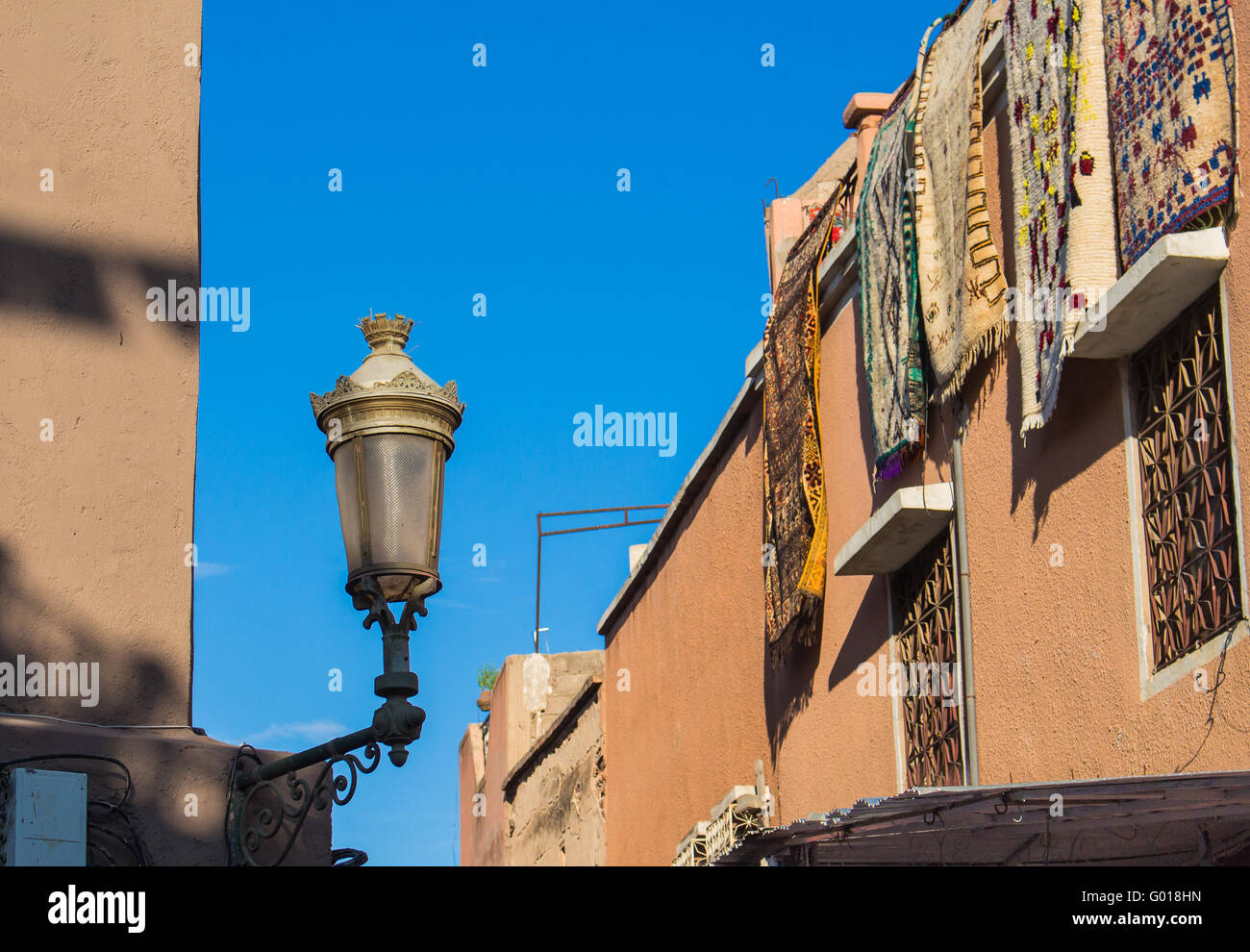 Building with a street lamp, lantern and a shop with traditional ...