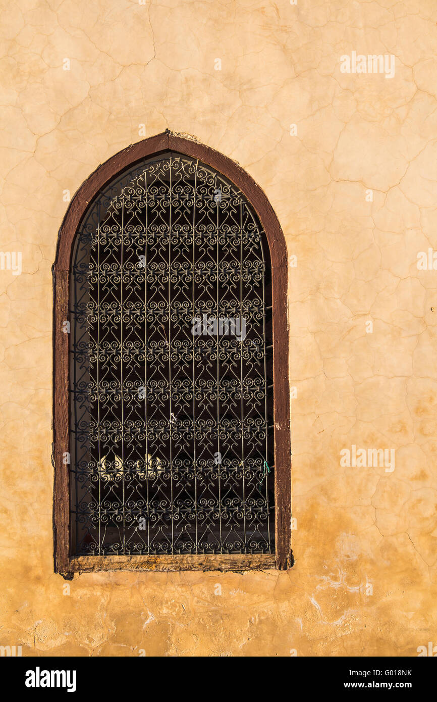 Traditional arabian window with an arch and ornamental lattice. Light ...