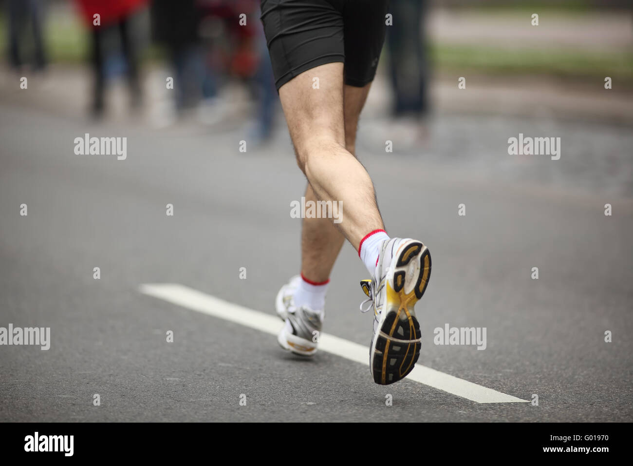 A men is jogging on a street Stock Photo - Alamy