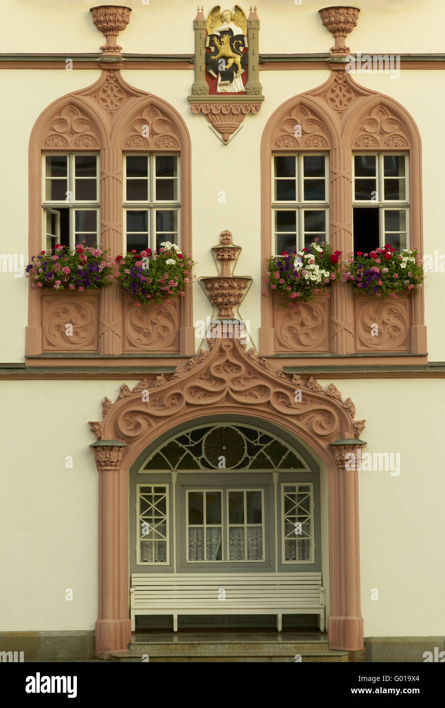 City hall facade with town coat of arms Stock Photo - Alamy