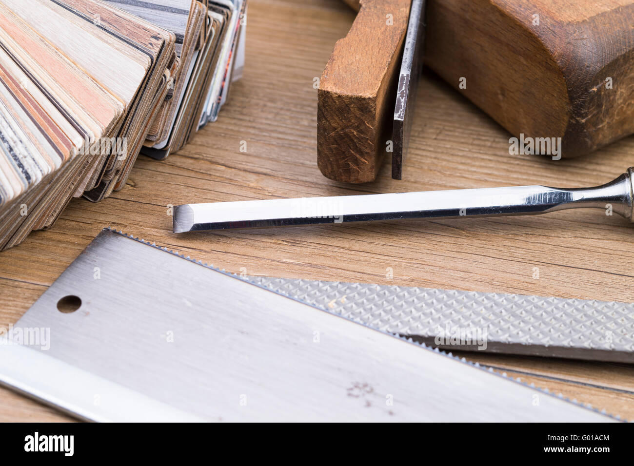 Tools and samples of inlay on wooden table Stock Photo - Alamy