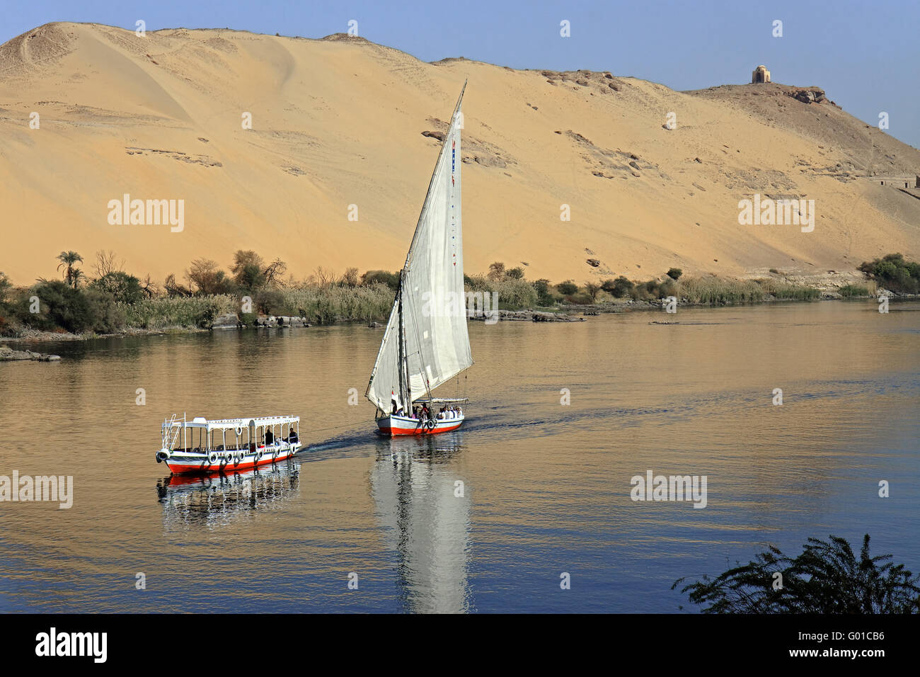 Egypt Aswan Boats Sailing Past Desert Landscape Stock Photo - Alamy