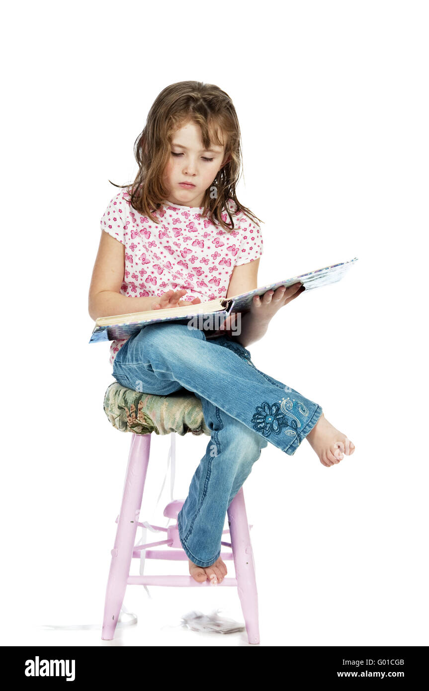 Reading a big book Stock Photo - Alamy