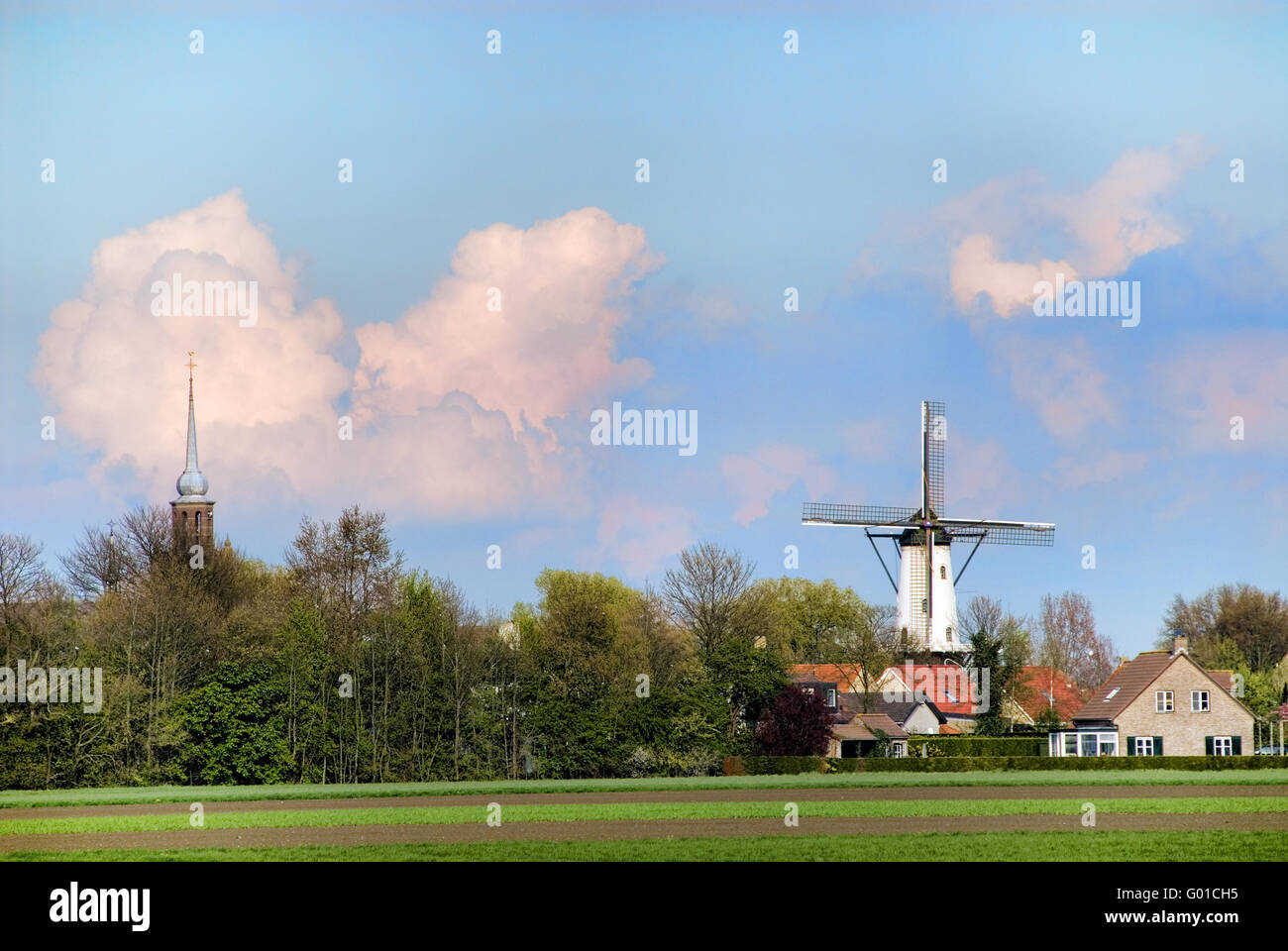 landscape sight on little village with windmill and churchtower Stock ...