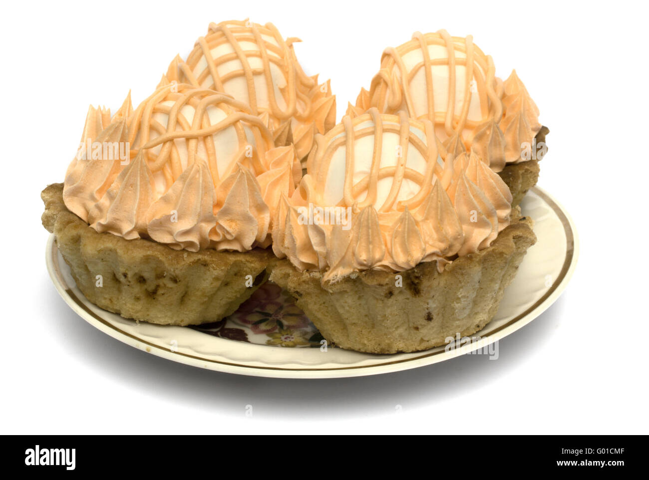 Four cake with a zephyr on a plate isolated on a white background Stock ...