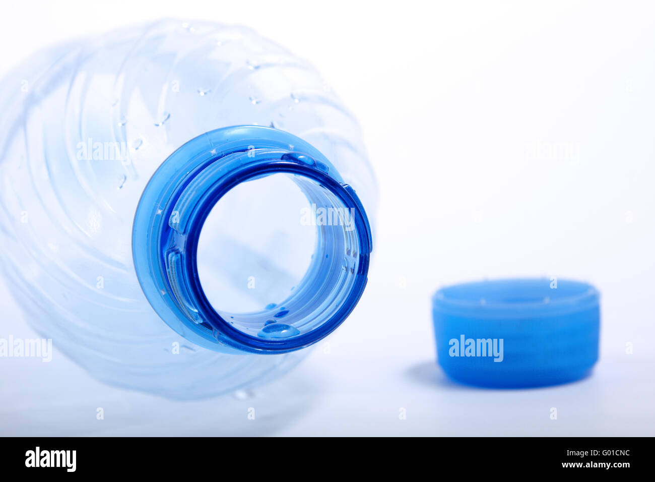 last drop of empty water bottle on white background Stock Photo - Alamy