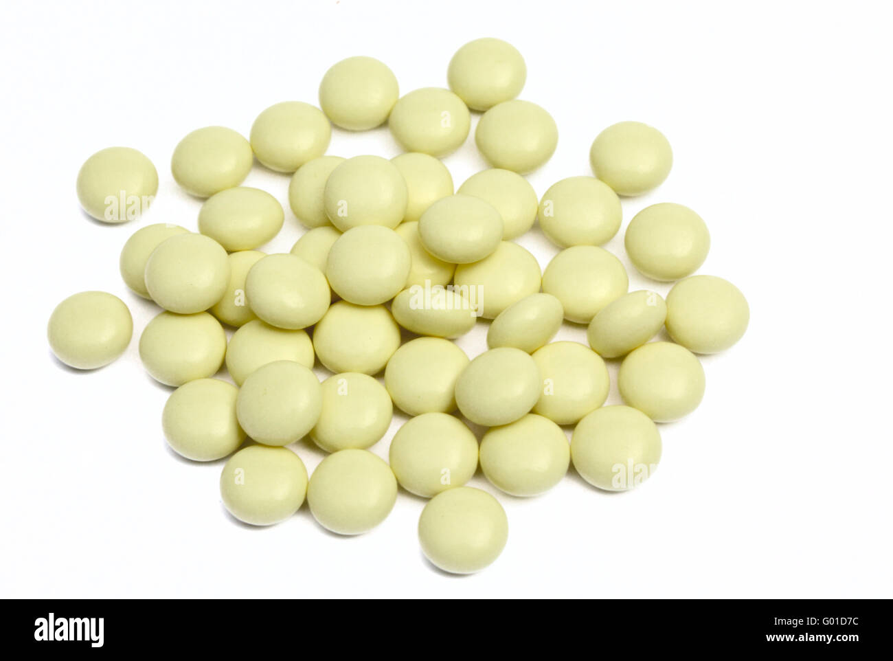 Heap of yellow tablets on a white background it is isolated Stock Photo ...