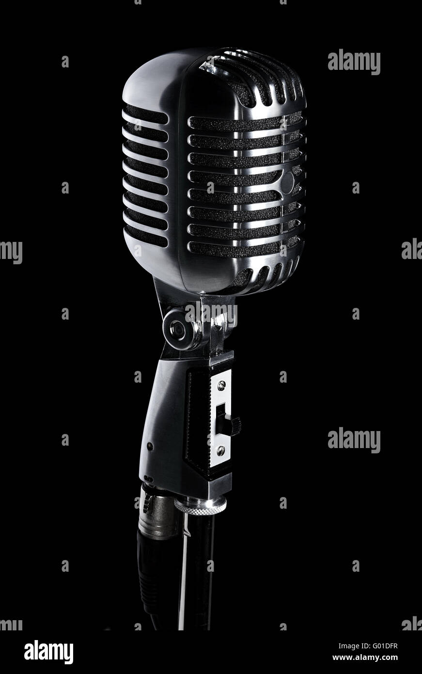 Retro microphone on stand isolated on black Stock Photo - Alamy
