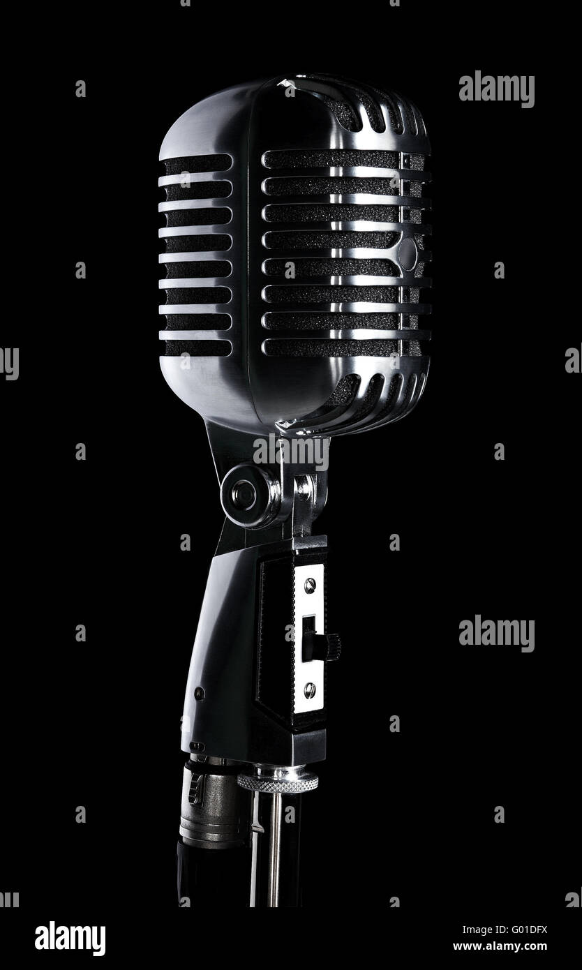 Retro microphone on stand isolated on black Stock Photo - Alamy