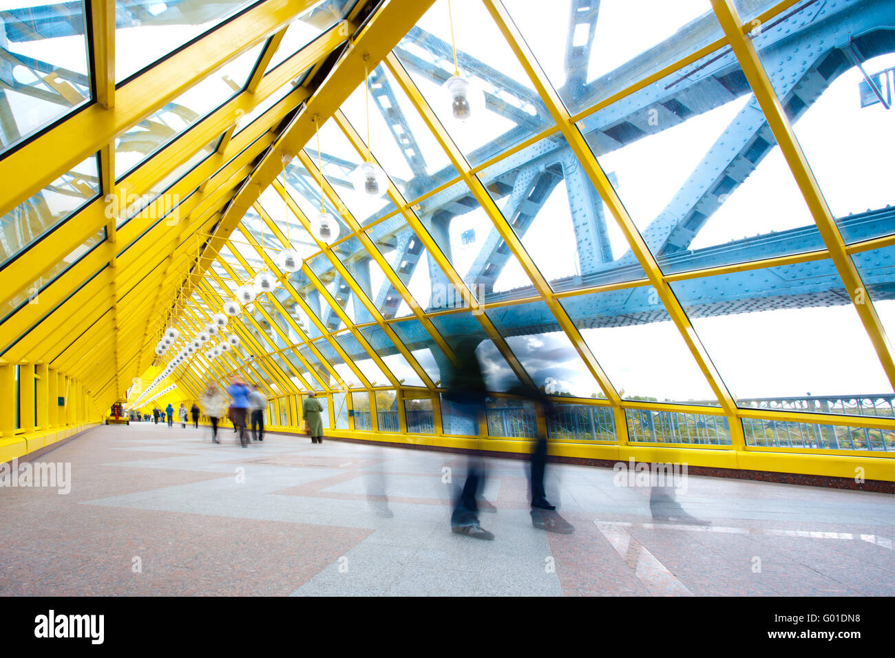 People silhouettes in motion in yellow corridor Stock Photo - Alamy