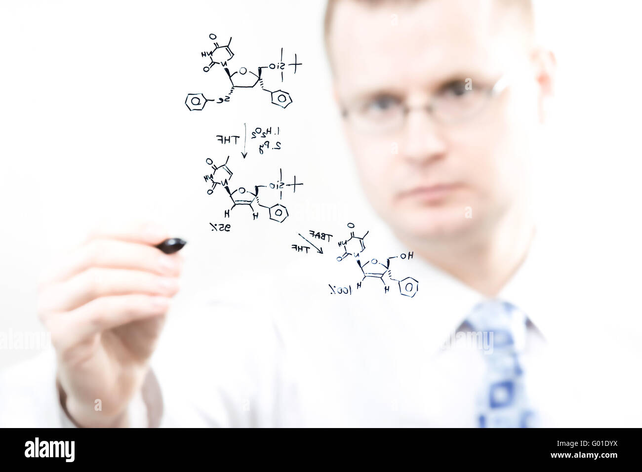 young chemist writing organic chemistry reaction equation Stock Photo ...