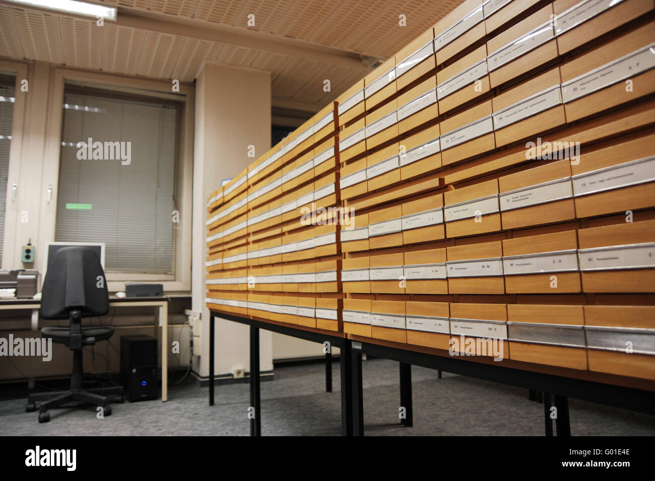 Filing cabinets & workplace in library Stock Photo - Alamy