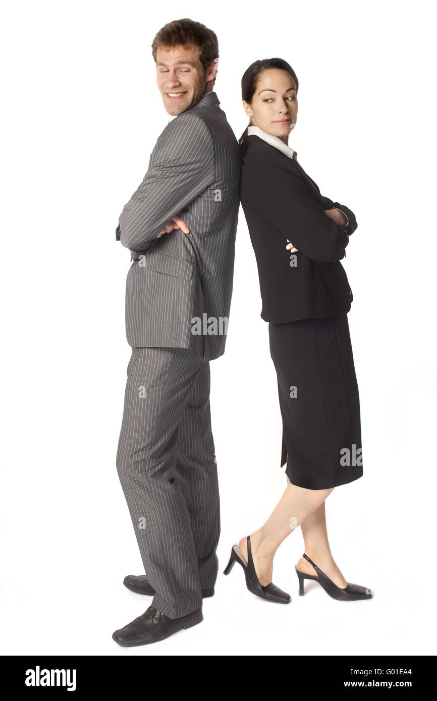Confident work colleagues standing back to back Stock Photo - Alamy