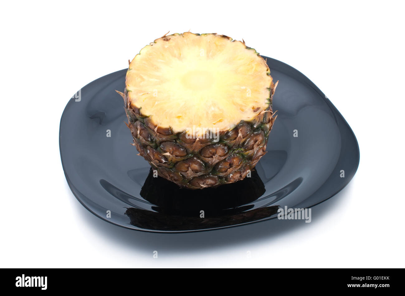 Half cut pineapple isolated on white background Stock Photo - Alamy