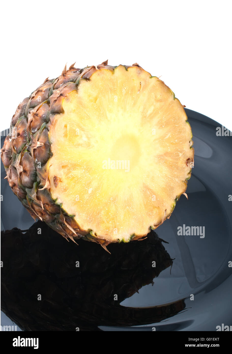 Half cut pineapple isolated on white background Stock Photo - Alamy