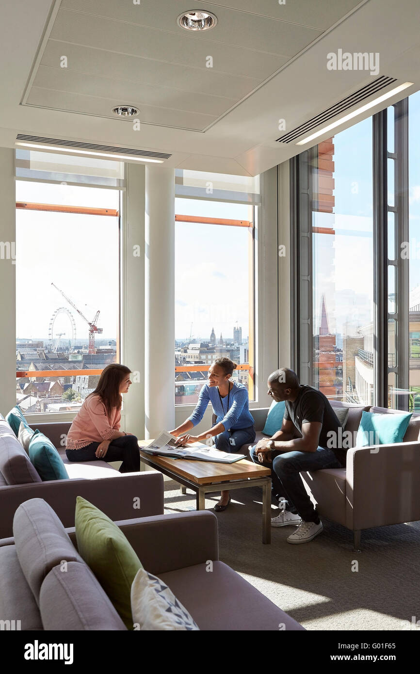 Detail of glazed breakout space and lounge in office. Central Saint ...