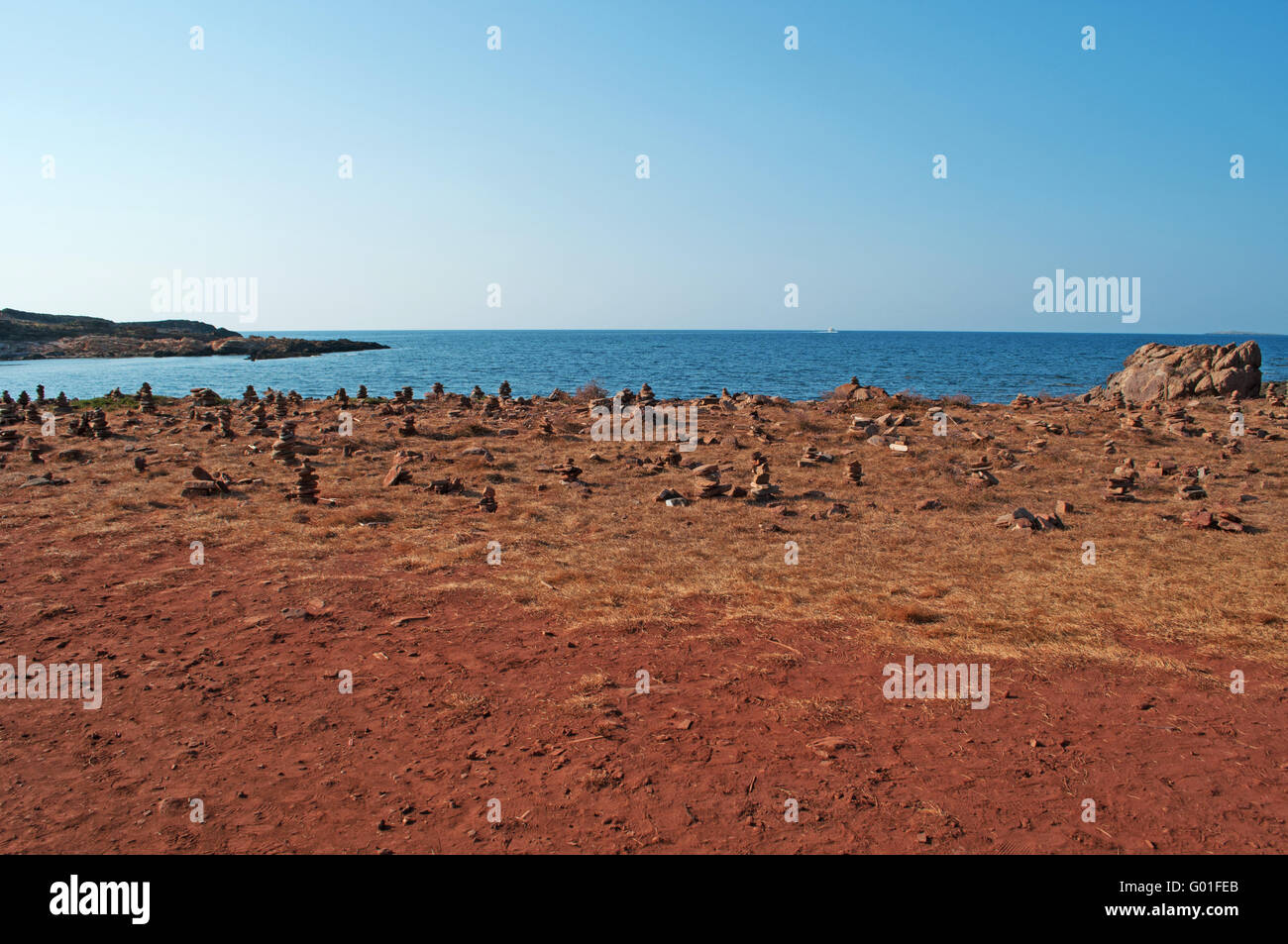 Menorca: red sand on the path to Cala Pregonda, secluded cove with ...