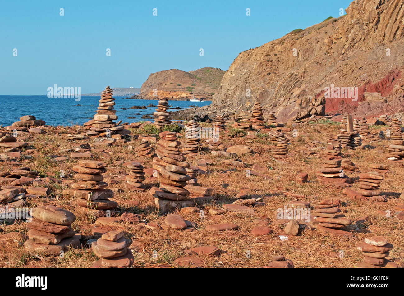 Menorca: red sand on the path to Cala Pregonda, secluded cove with ...