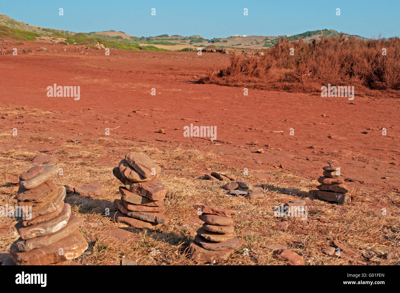 Menorca: red sand on the path to Cala Pregonda, secluded cove with ...