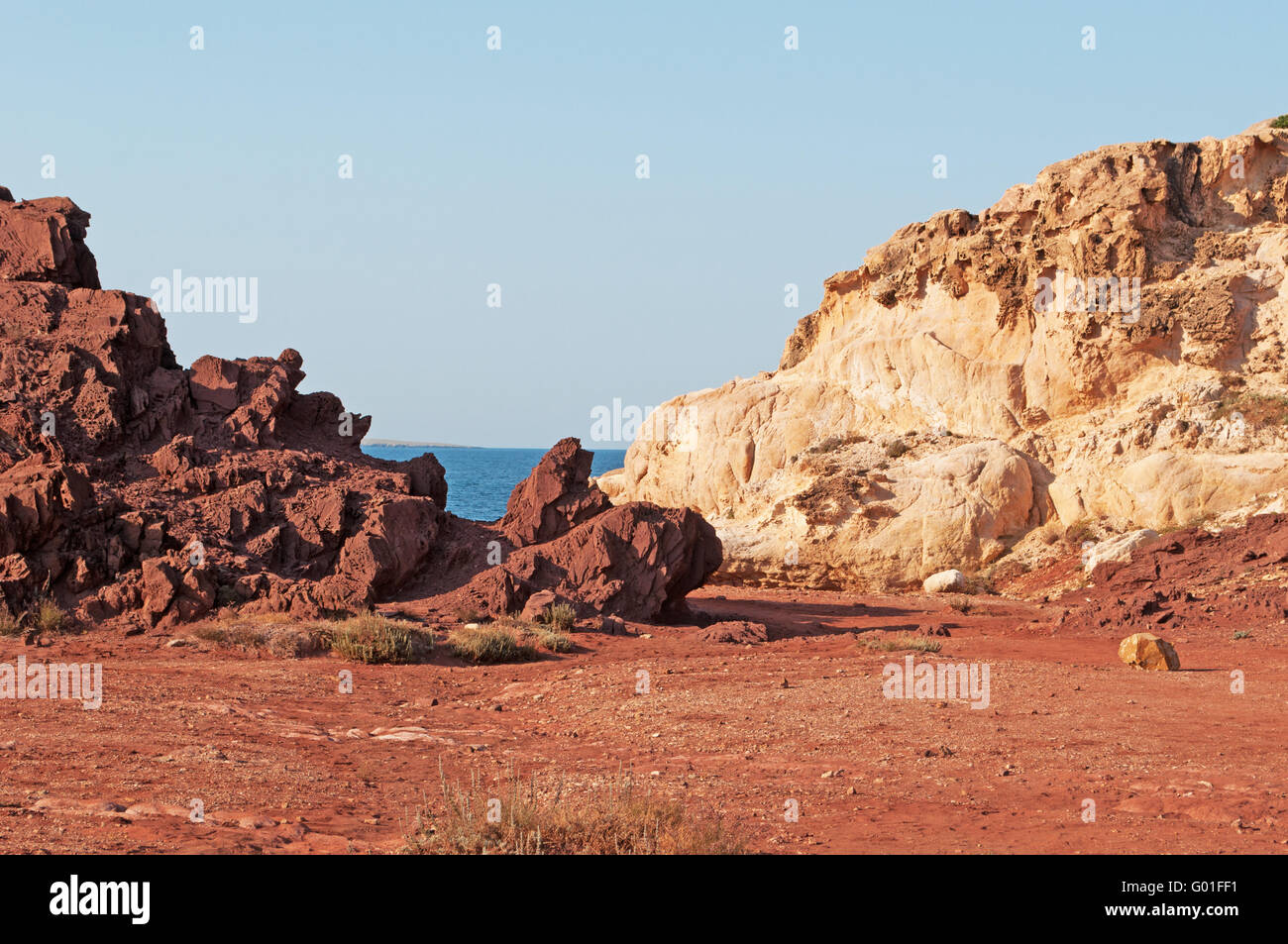 Menorca: red sand on the path to Cala Pregonda, secluded cove with ...