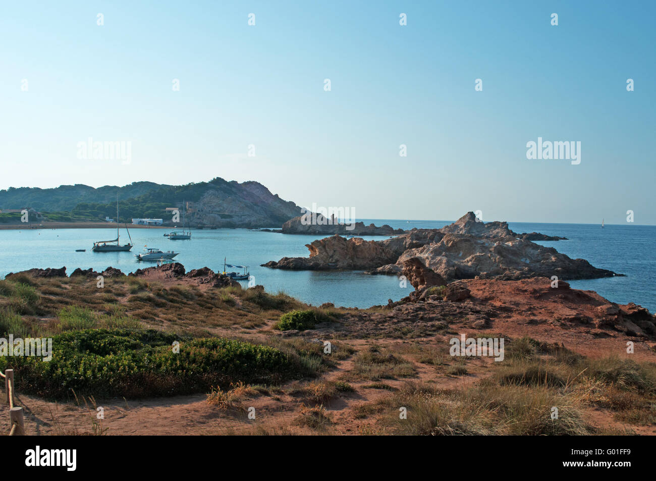 Menorca: red sand on the path to Cala Pregonda, secluded cove with ...