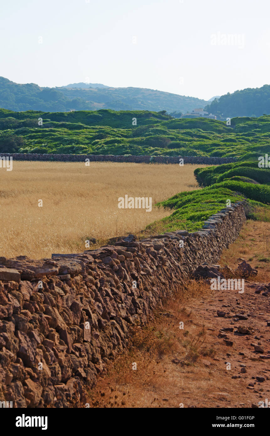 Menorca: red sand on the path to Cala Pregonda, secluded cove with ...