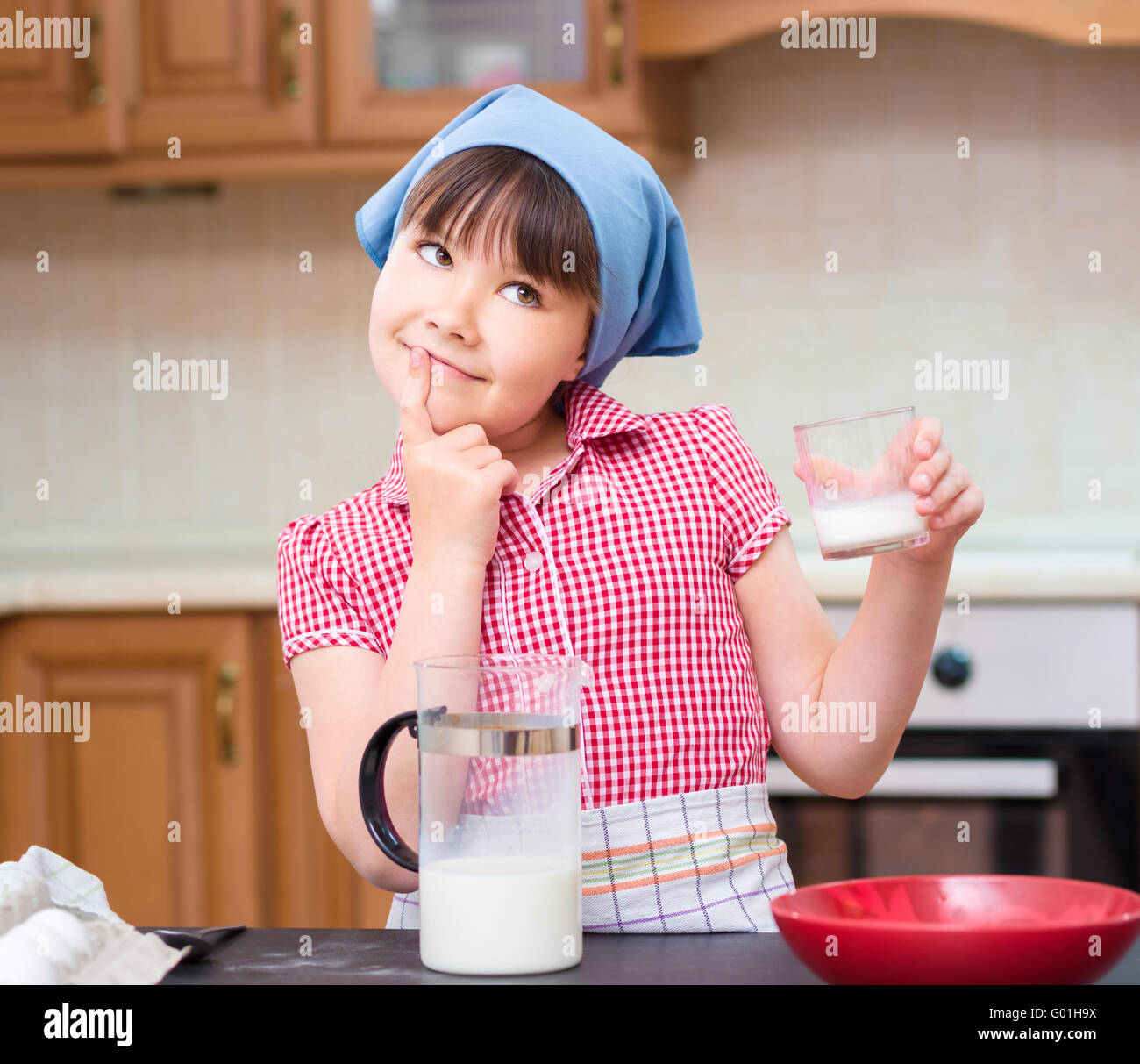 Girl cooking thinking looking up High Resolution Stock Photography and ...