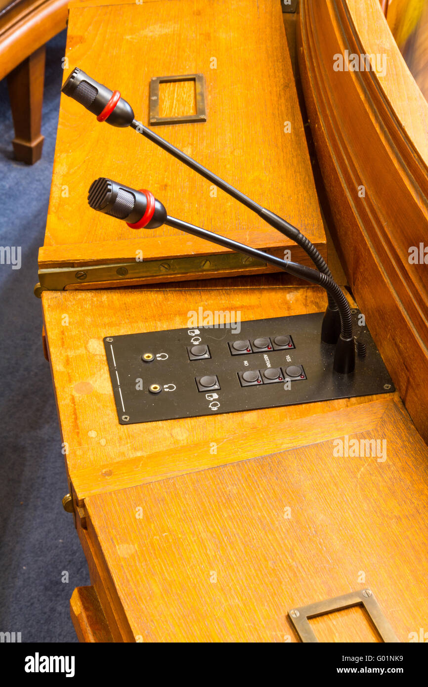 Two microphones for speaking in a council chamber Stock Photo - Alamy