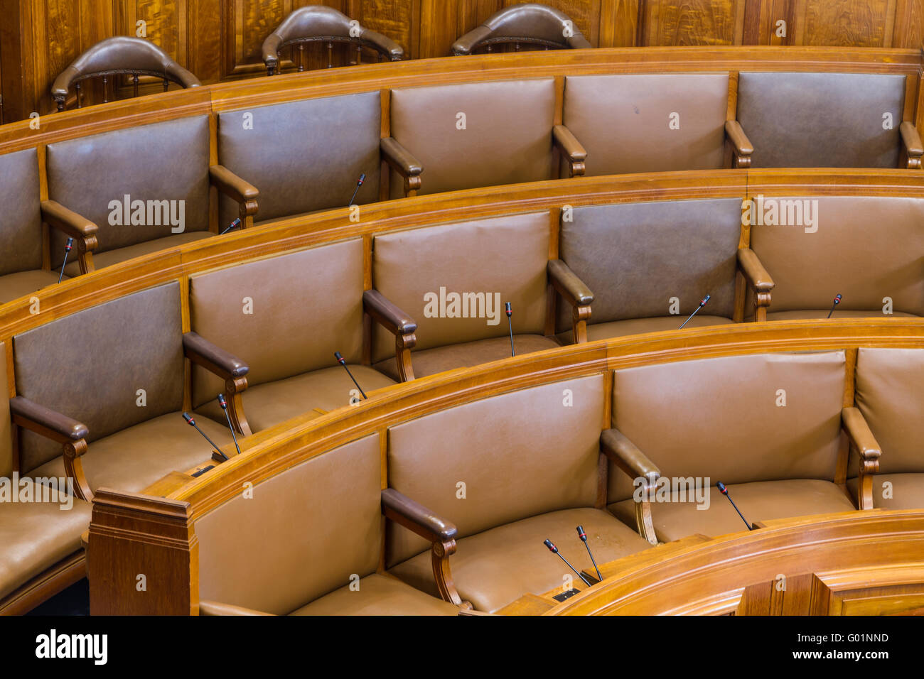 Wood and leather seats in a council chamber. Wood and leather ...