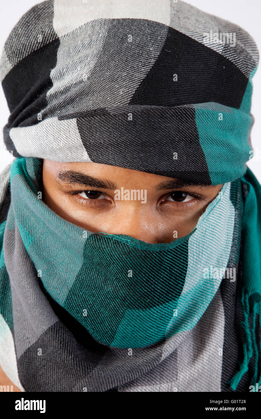 Dark Complected man with his face wrapped in a scarf Stock Photo - Alamy