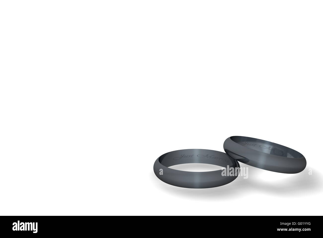 two wedding rings with just married engraving Stock Photo - Alamy