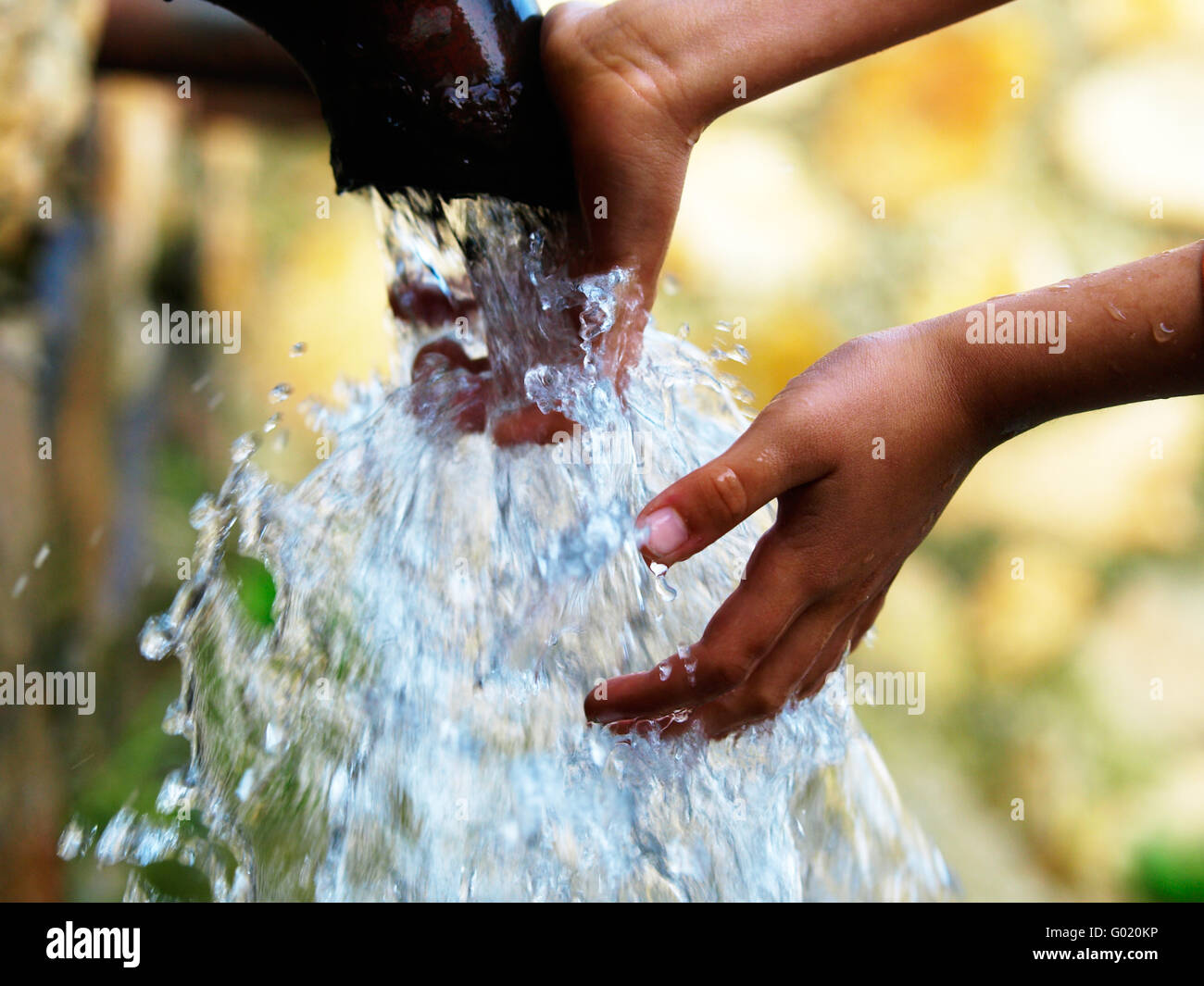 Child splashing water hands hi-res stock photography and images - Alamy