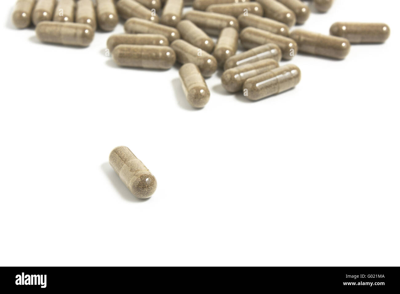 gray pills on white background it is isolated Stock Photo - Alamy