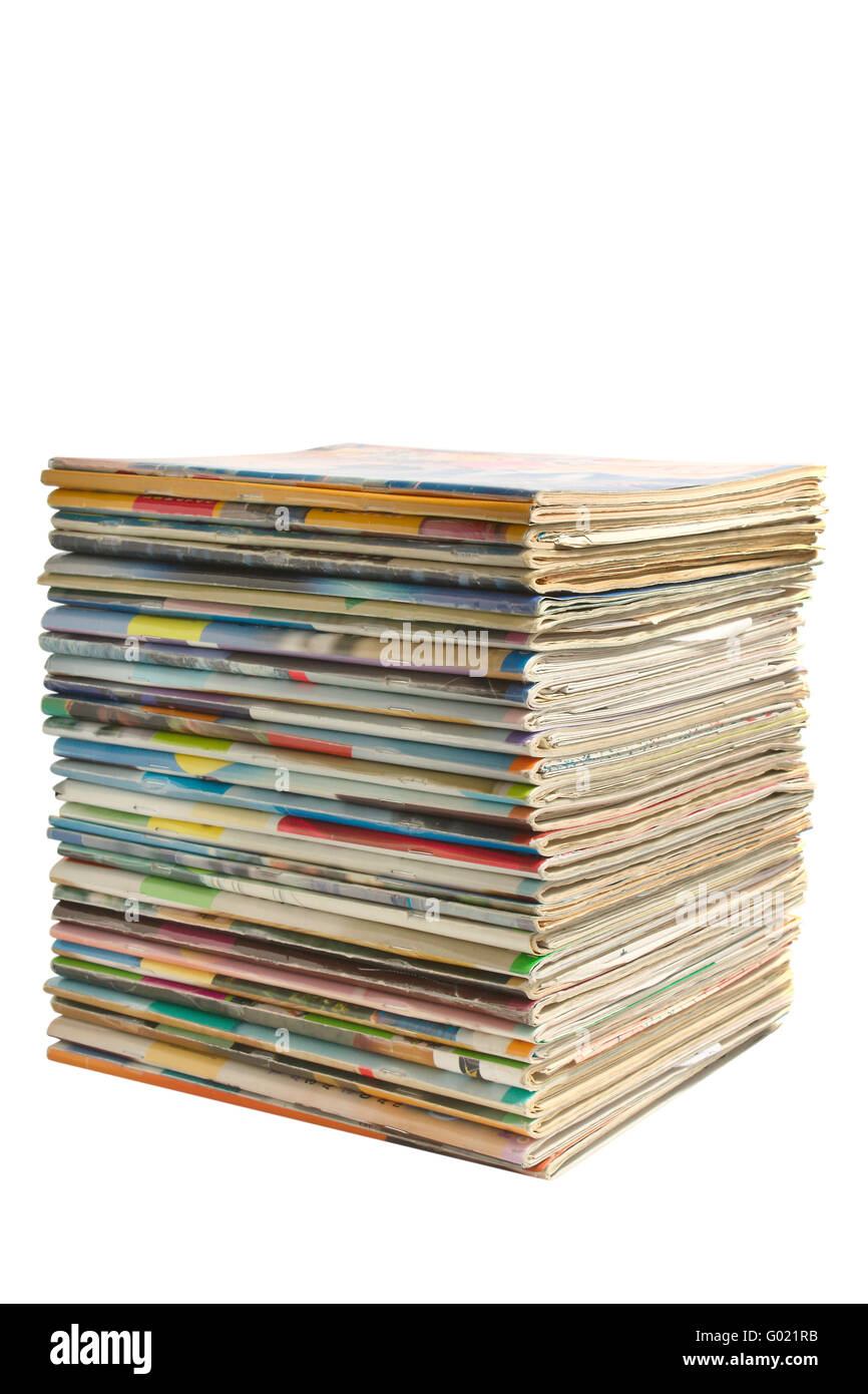 Heap of multi-coloured old magazines on a white background it is ...