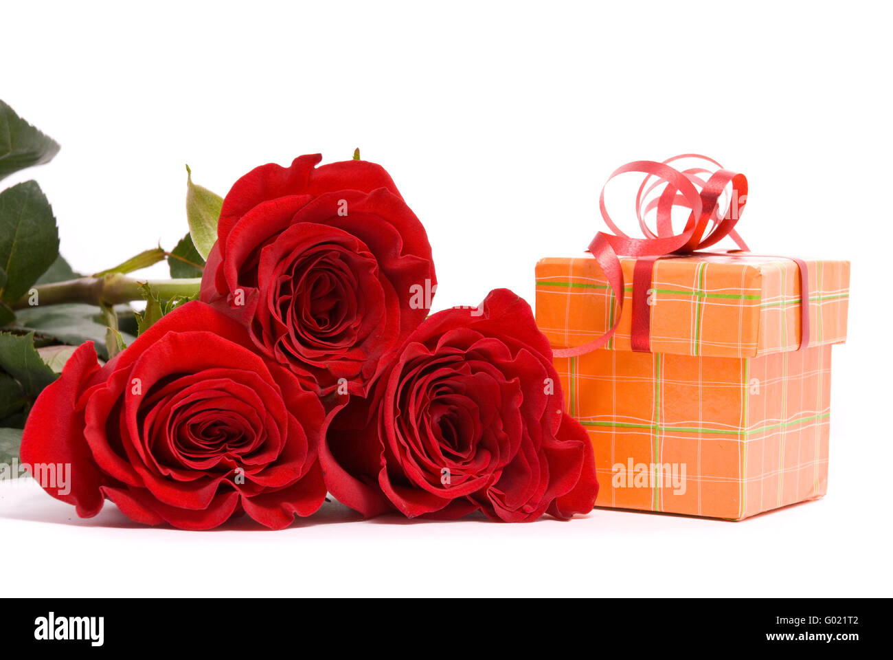 Red roses and gift box on a studio white background Stock Photo - Alamy